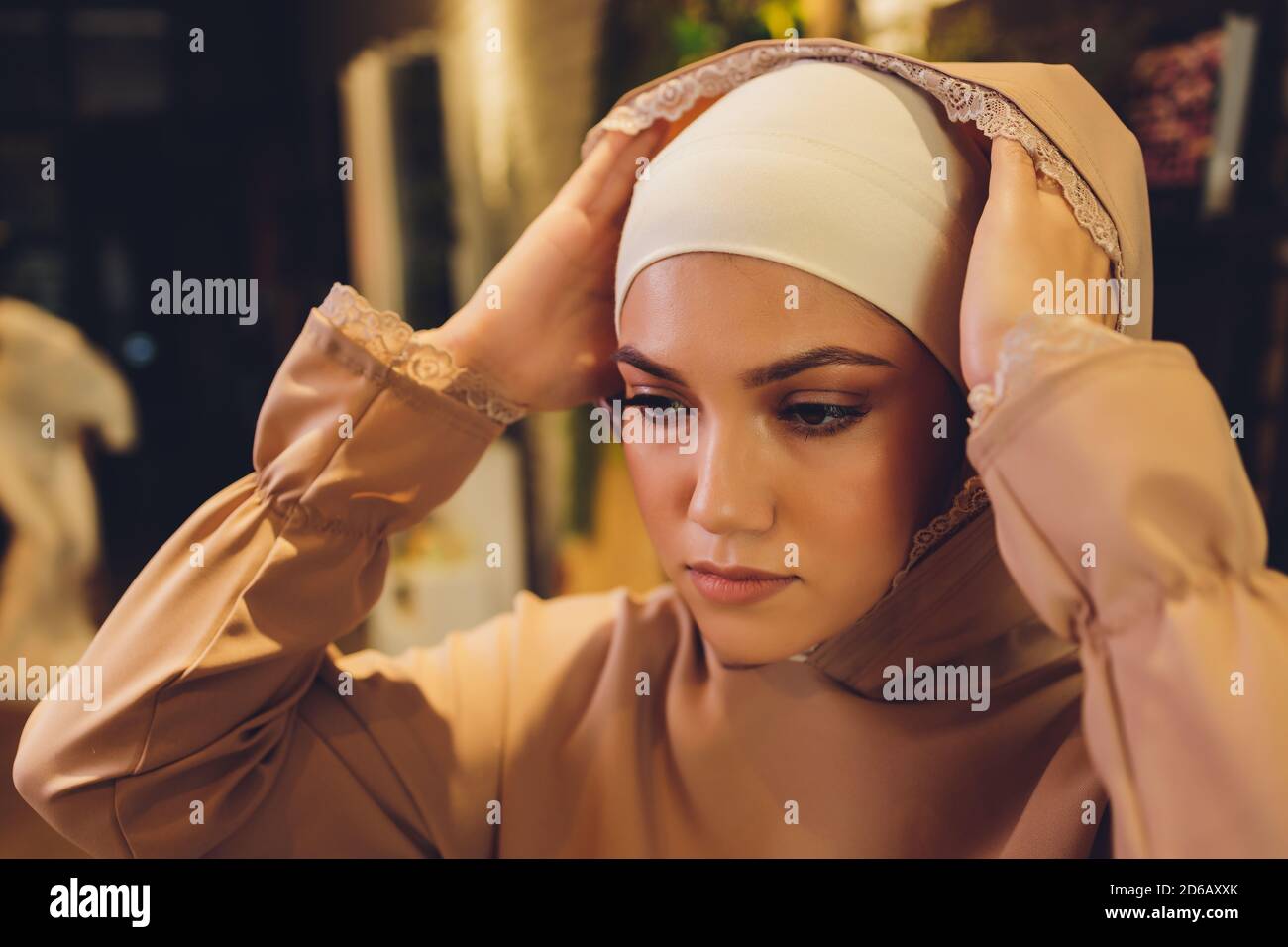Portrait of positive pretty young Arabian woman in pink headscarf ...
