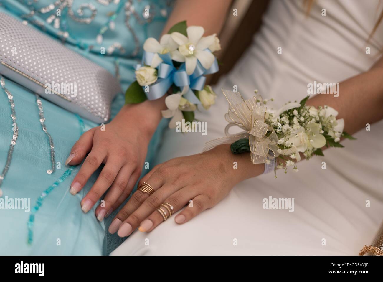 Prom Corsages strap on the hand of two female prom attendee Stock Photo ...
