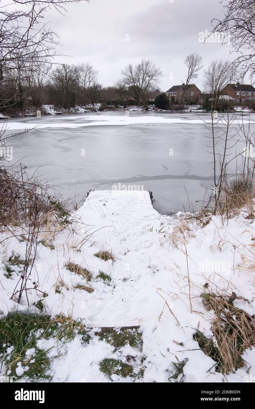 Frozen over fishing lake image Stock Photo - Alamy