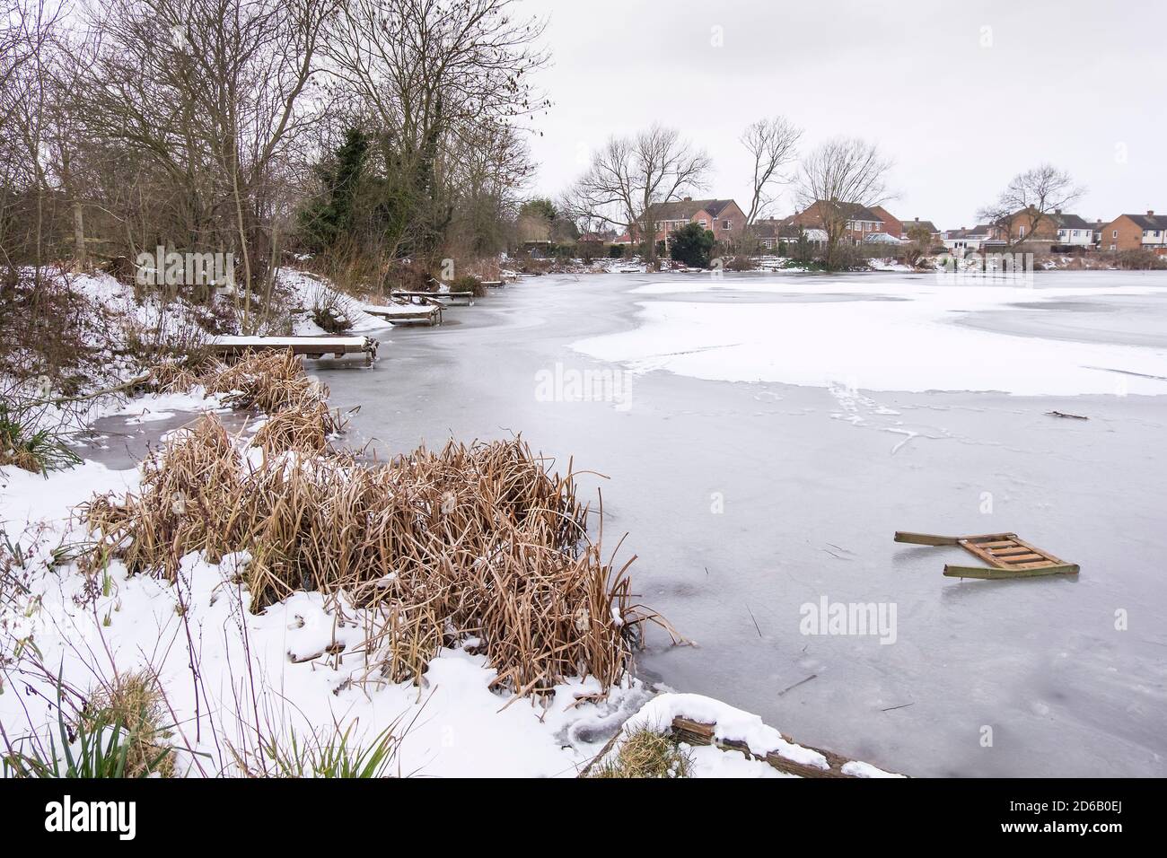 Frozen over fishing lake image Stock Photo - Alamy