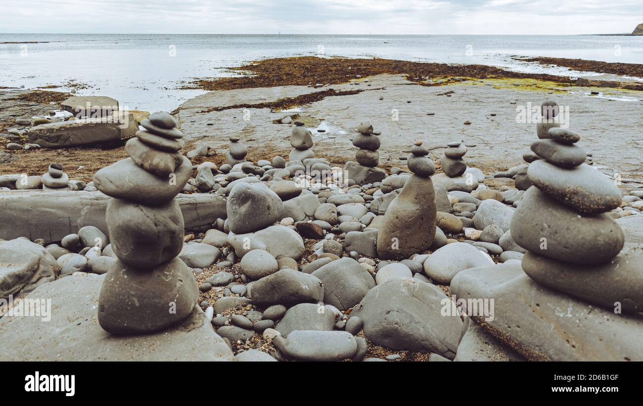 Stacked rocks into a standing still formation, pebbles by the beach put ...