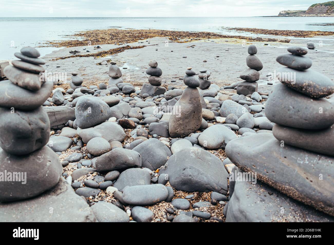 Stacked rocks into a standing still formation, pebbles by the beach put ...