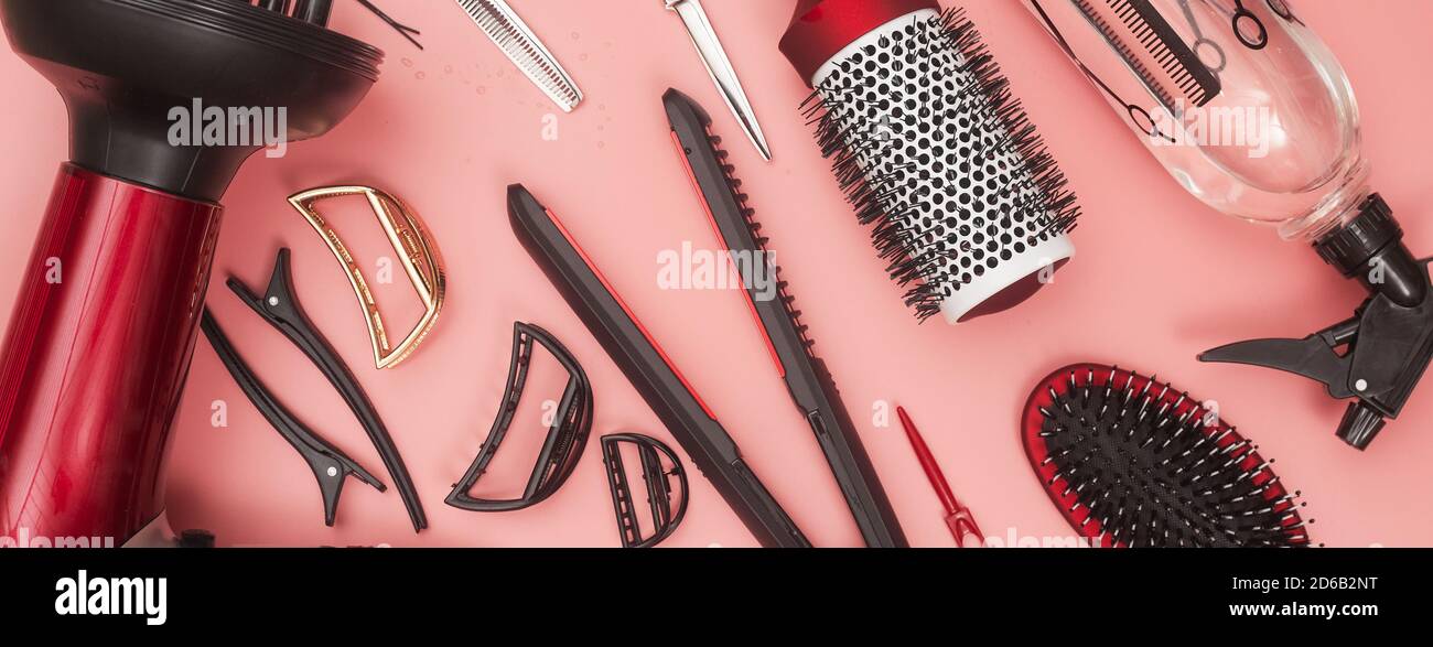 professional items for hairdressing, haircuts on a pink background ...
