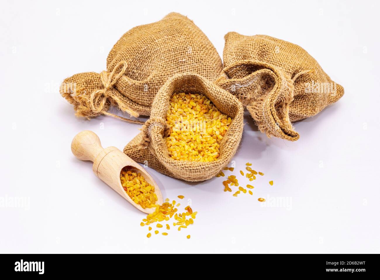 Bulgur grains isolated on white background. A traditional ingredient in ...