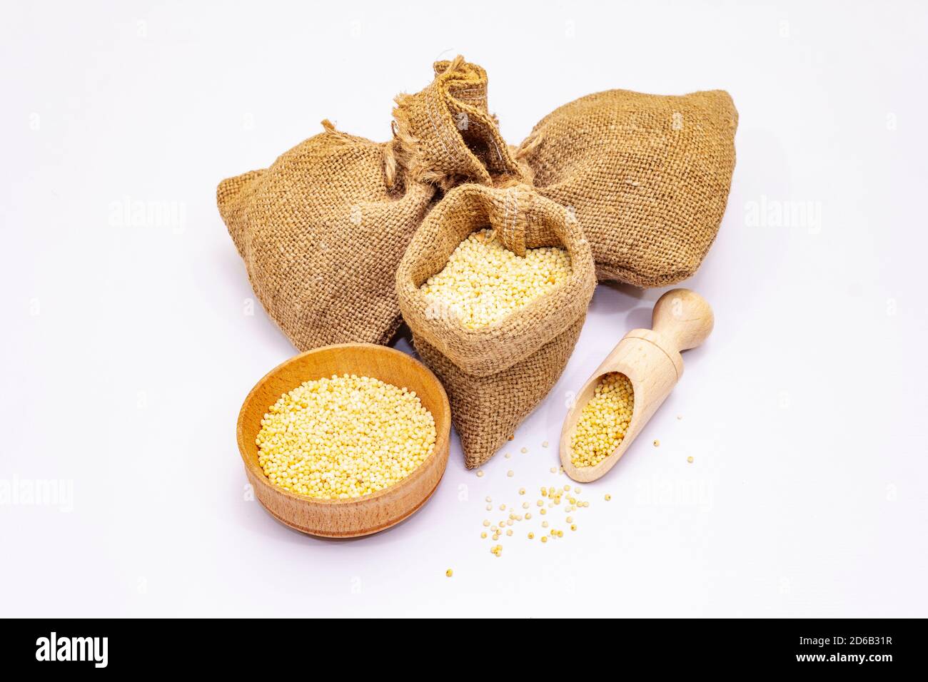 Whole peeled millet grains isolated on white background. A traditional ...