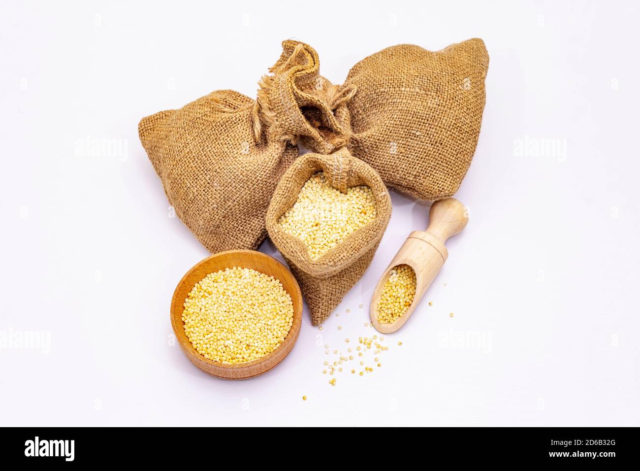 Whole peeled millet grains isolated on white background. A traditional ...