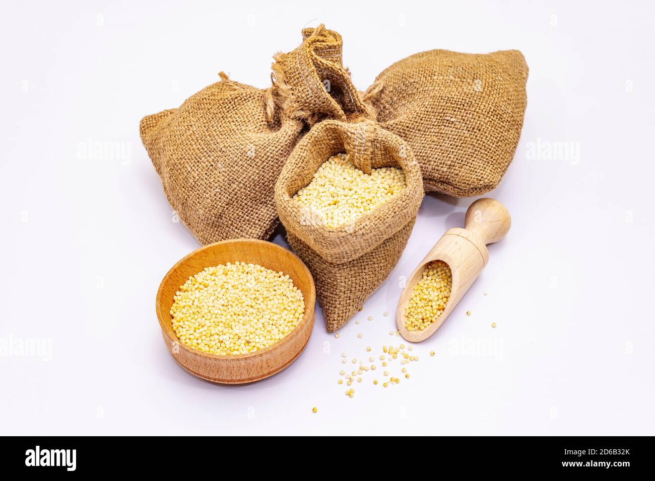Whole peeled millet grains isolated on white background. A traditional ...