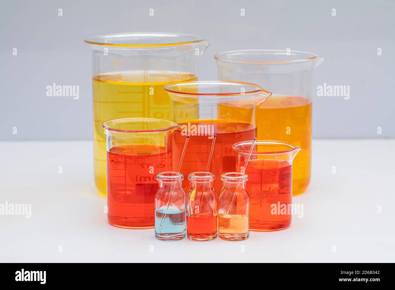 Beaker with color liquid. Solution chemistry. Laboratory beaker with ...