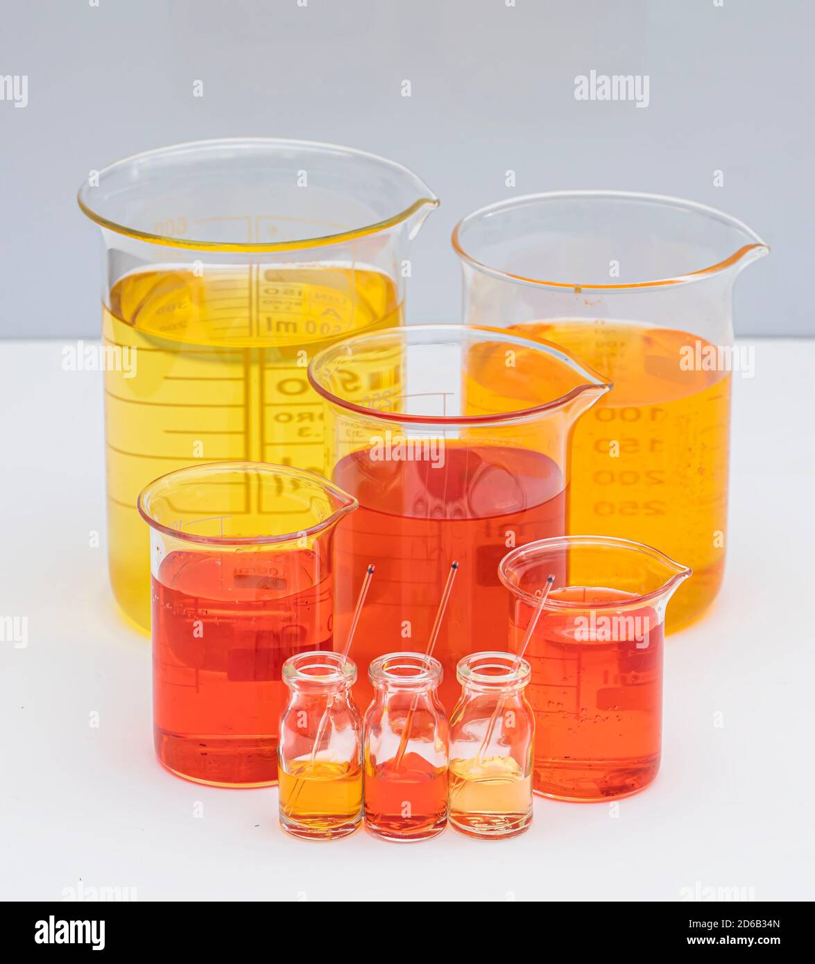 Beaker with color liquid. Solution chemistry. Laboratory beaker with ...