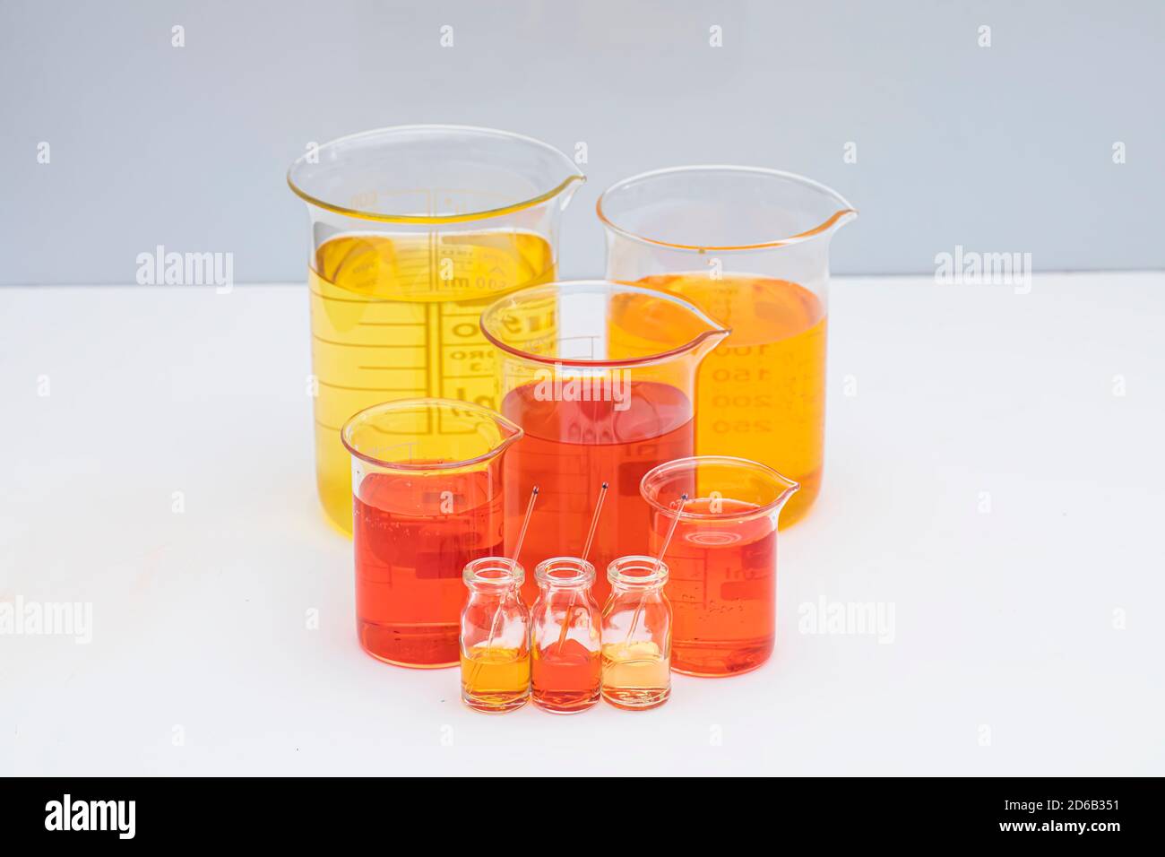 Beaker with color liquid. Solution chemistry. Laboratory beaker with ...