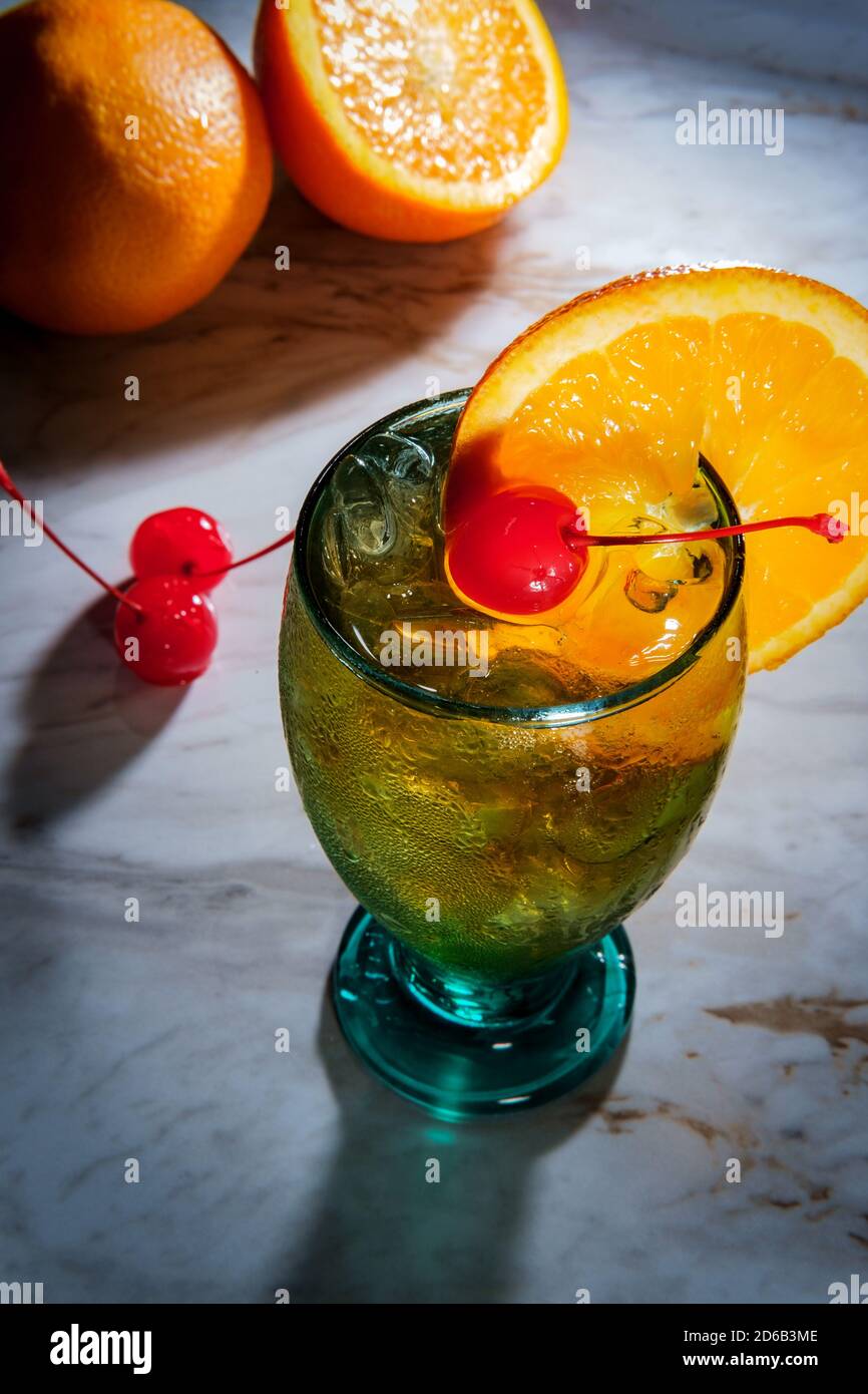 Old fashioned whiskey cocktail on the rocks with orange slice and ...