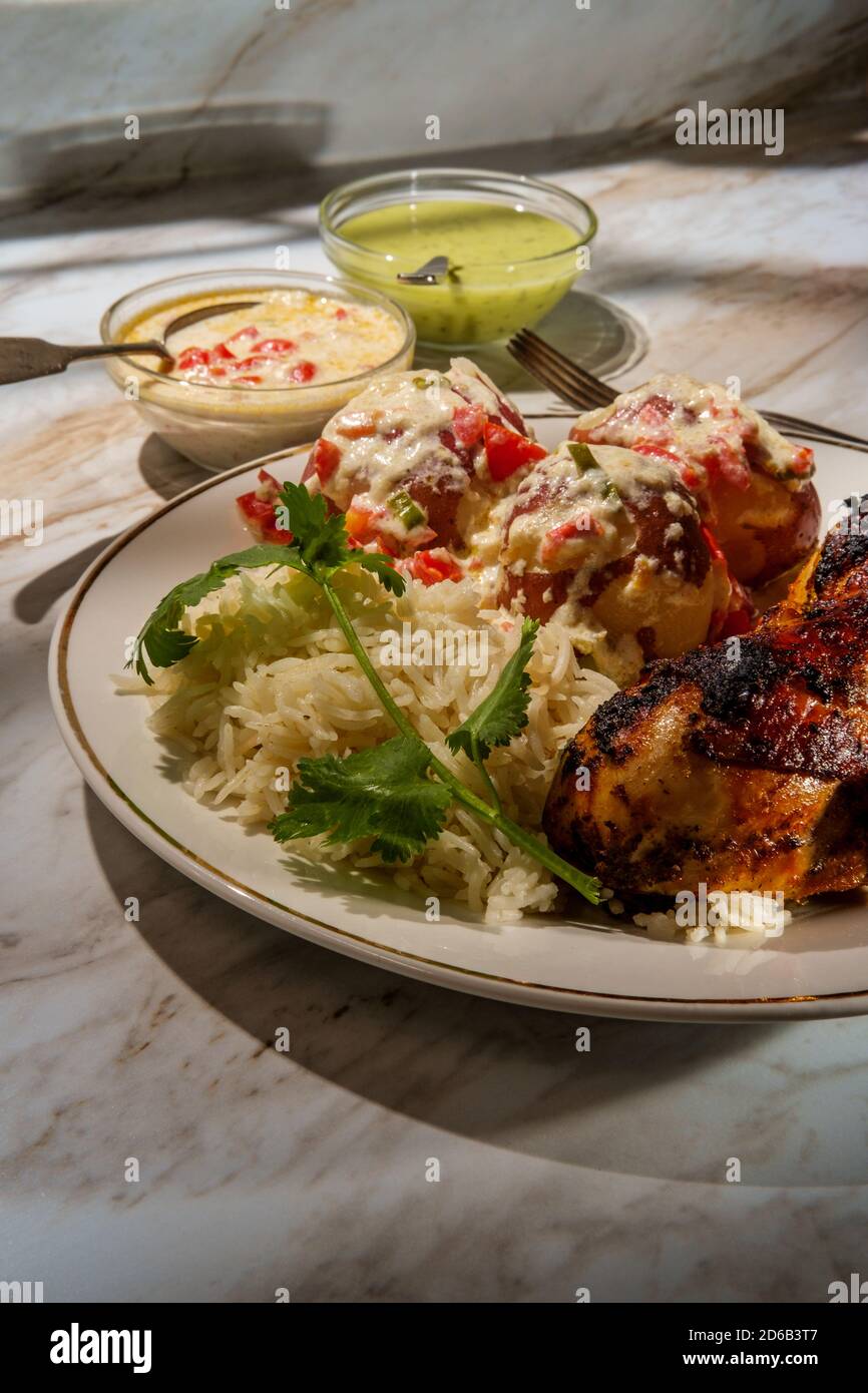 Colombian cuisine papas chorreadas roasted chicken legs and rice Stock ...