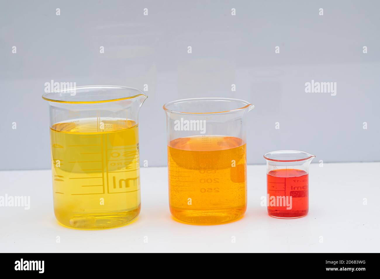Beaker with color liquid. Solution chemistry. Laboratory beaker with ...