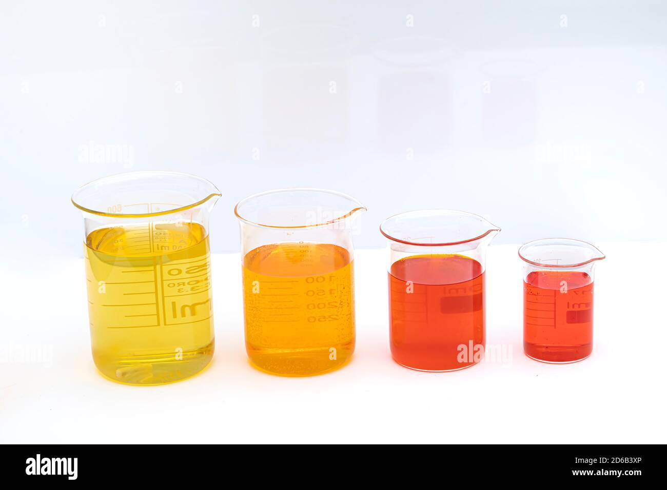 Beaker with color liquid. Solution chemistry. Laboratory beaker with ...