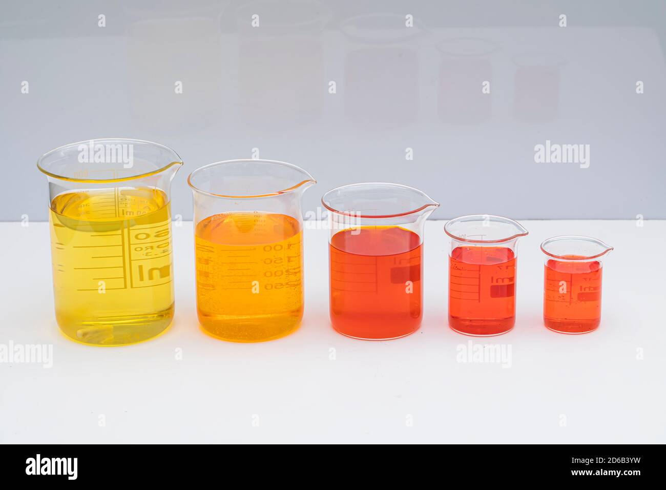 Beaker with color liquid. Solution chemistry. Laboratory beaker with ...