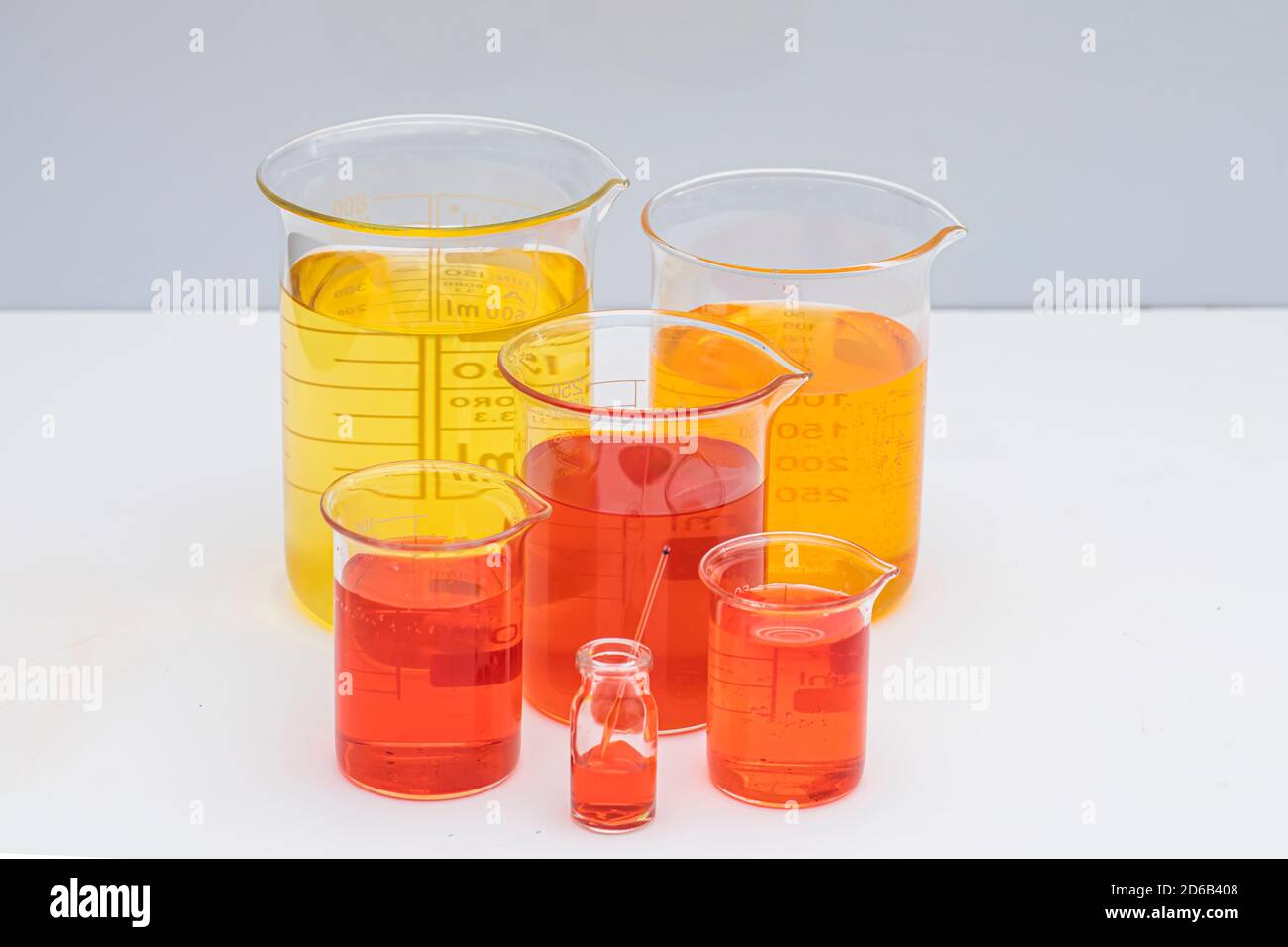 Beaker with color liquid. Solution chemistry. Laboratory beaker with ...