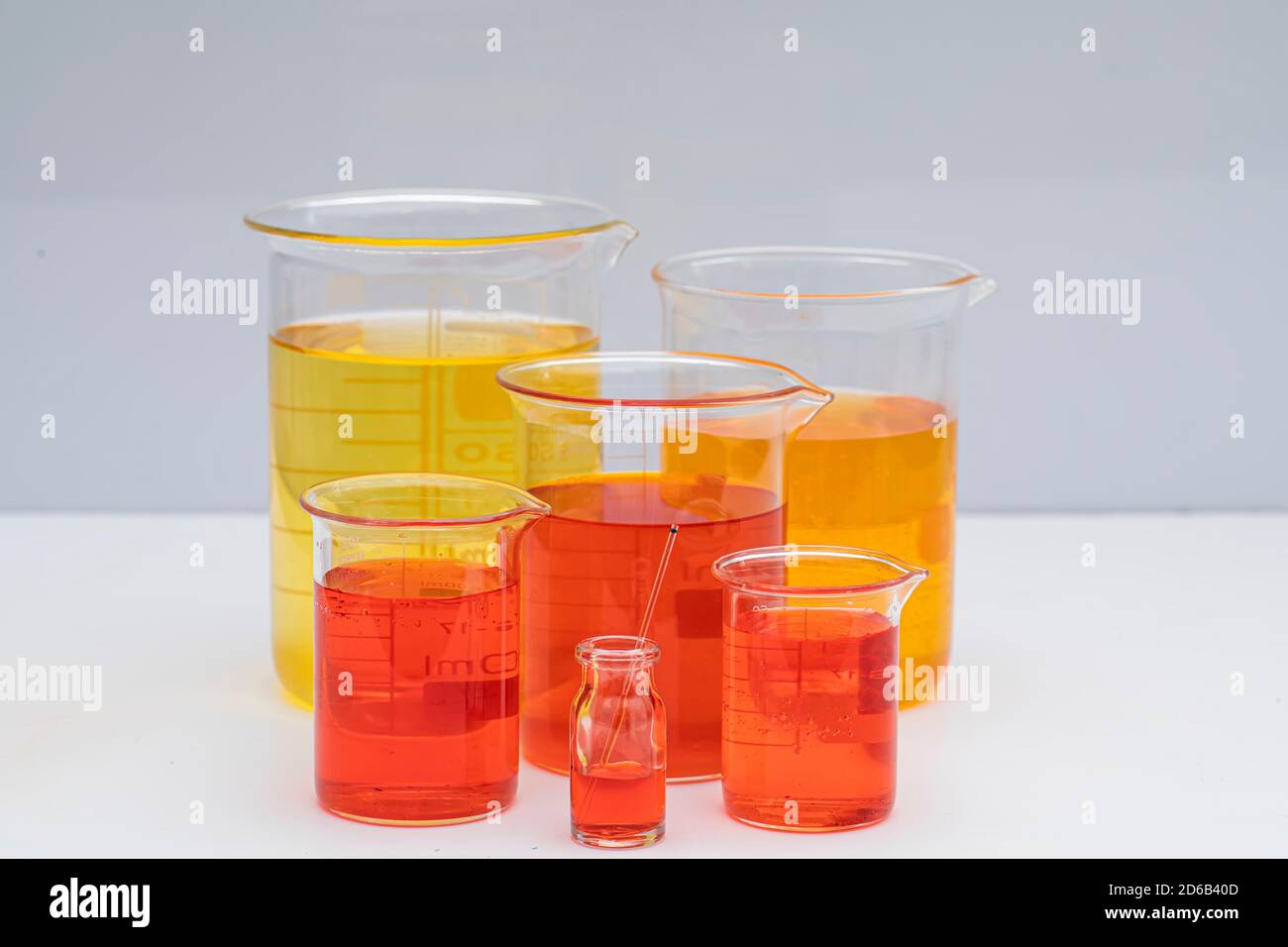 Beaker with color liquid. Solution chemistry. Laboratory beaker with ...