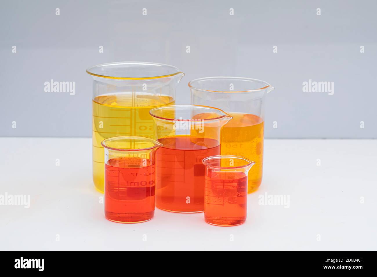 Beaker with color liquid. Solution chemistry. Laboratory beaker with ...