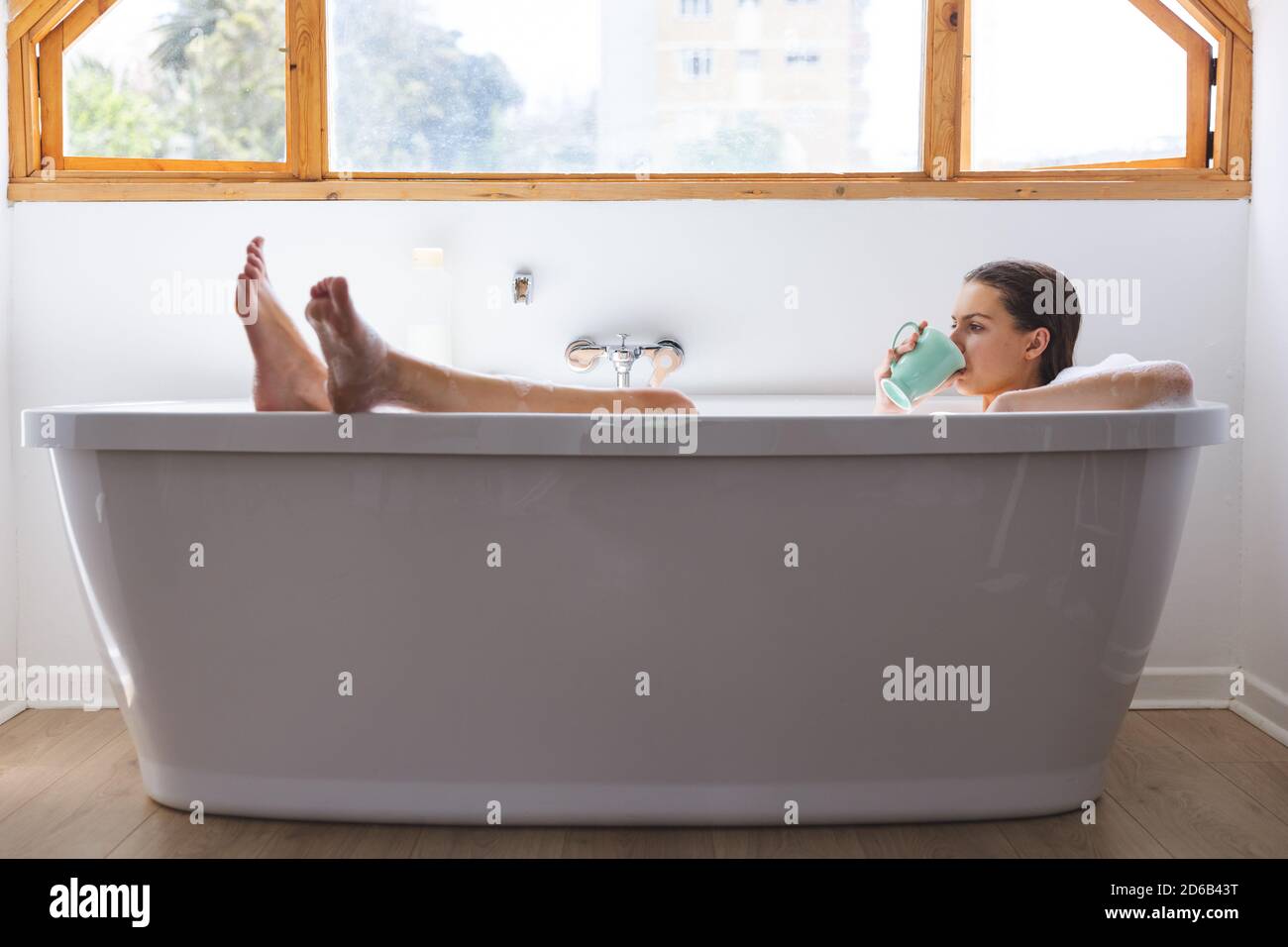 Woman bathing in coffee cup hi-res stock photography and images - Alamy