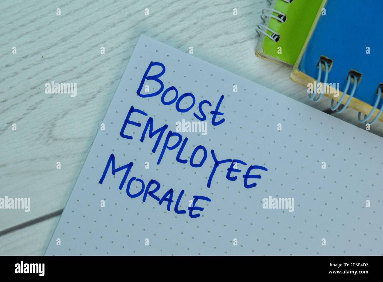 Boost Employee Morale write on a book isolated on office desk Stock ...