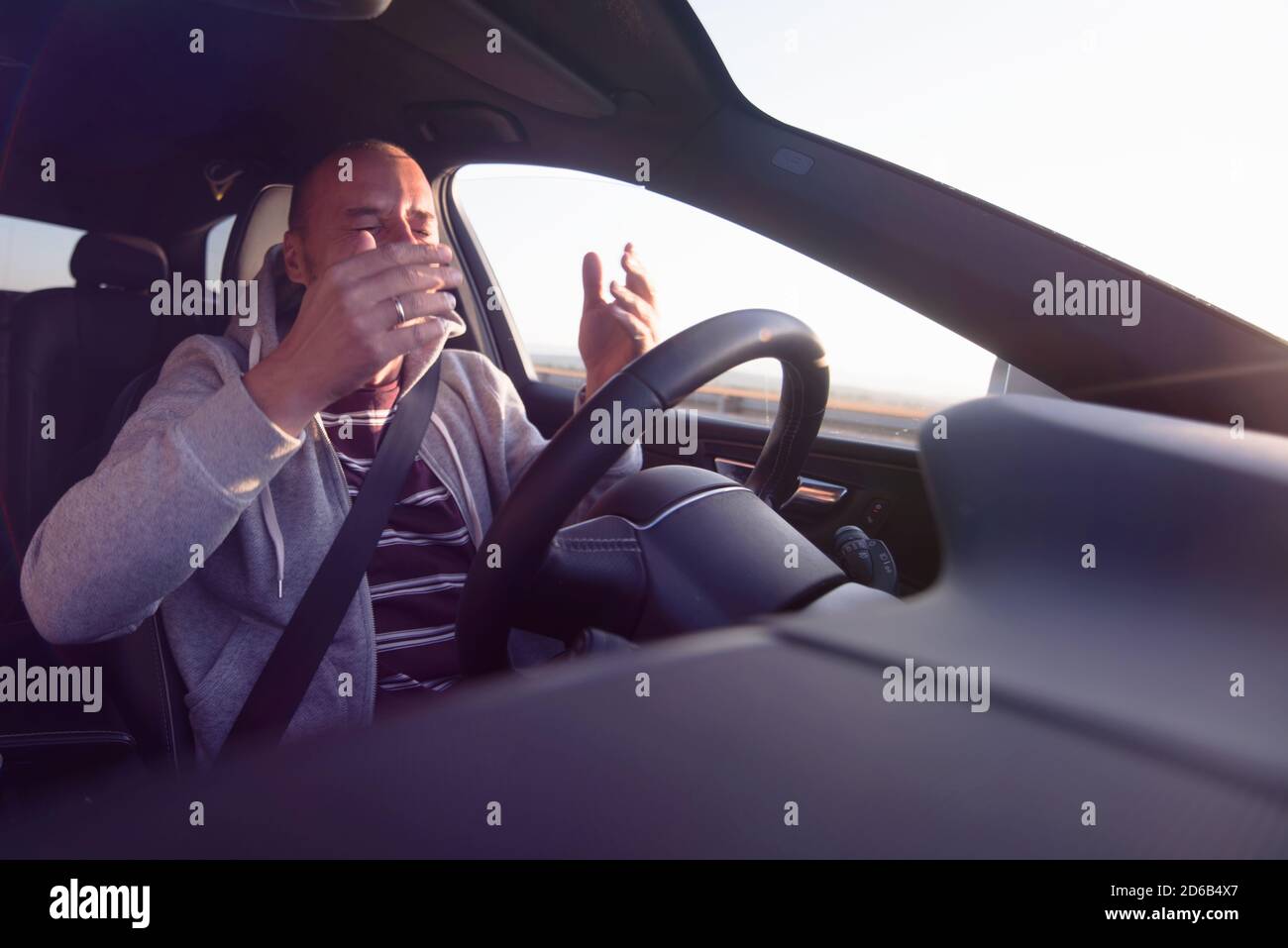 Young man driving a car shocked about to have traffic accident Stock ...