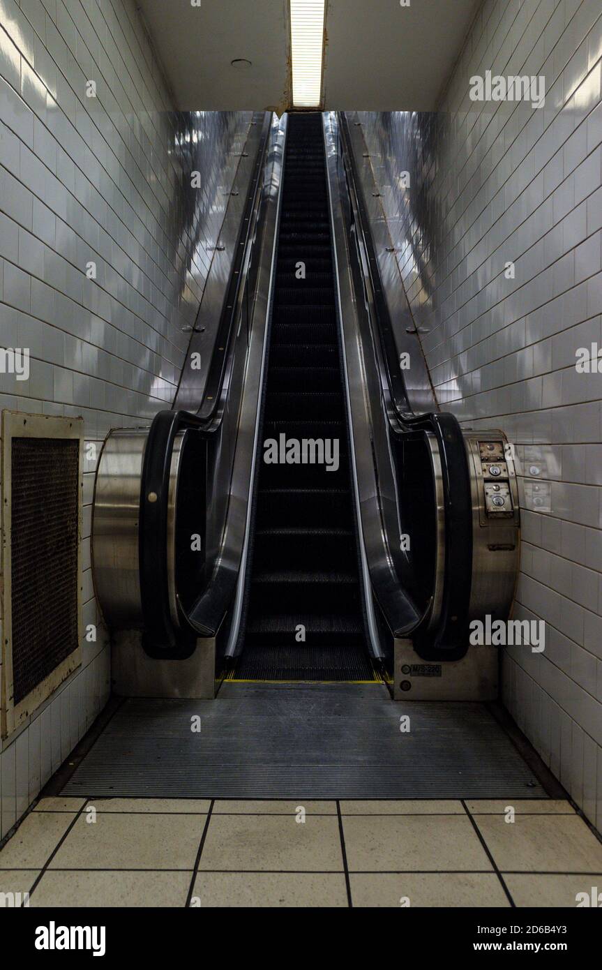 Symmetrical old vintage escalator in NYC subway station Stock Photo - Alamy