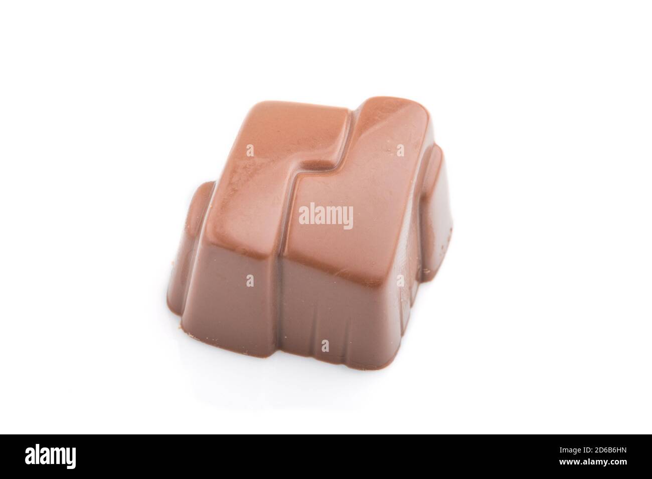 Single chocolate candy isolated on white background. side view, close ...