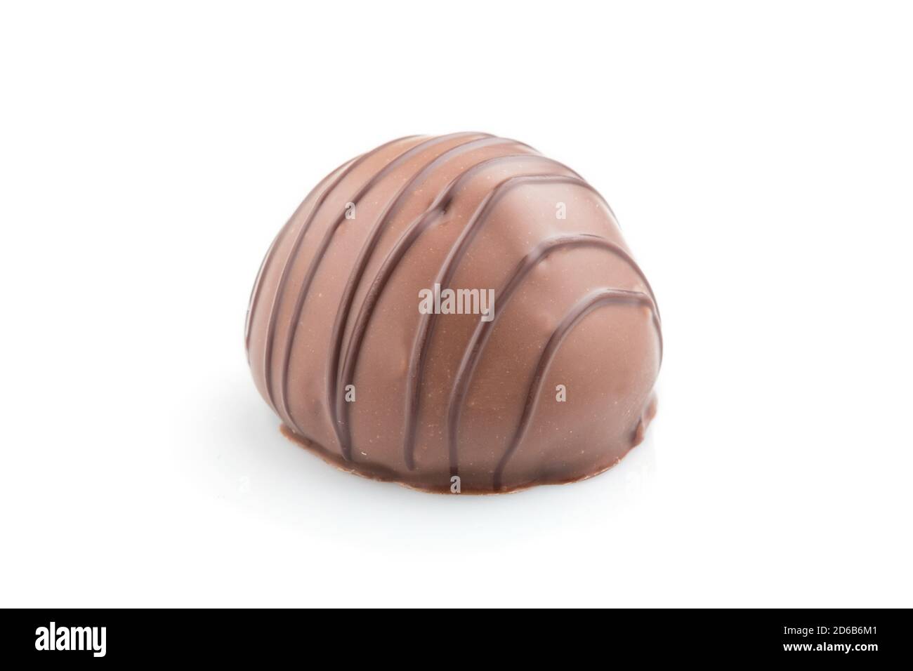 Single chocolate candy isolated on white background. side view, close ...