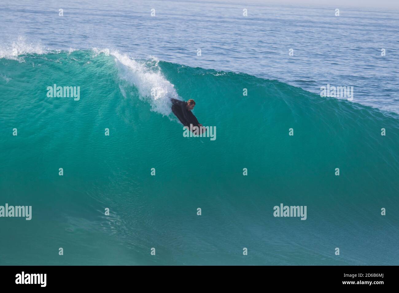 Mat Surfer riding a wave at the famous surf spot The Wedge, Newport ...