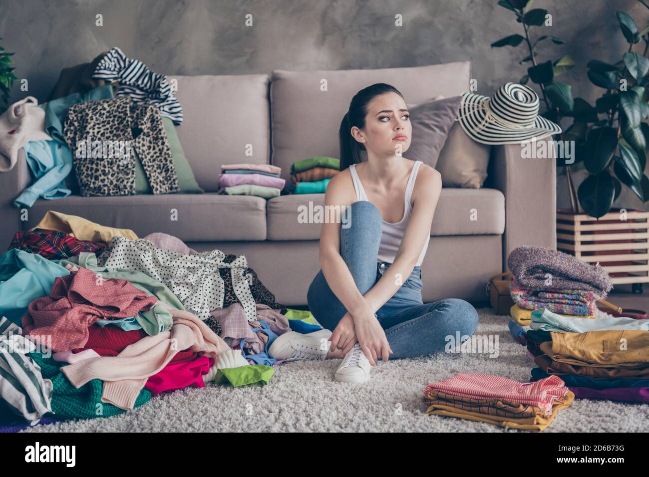 Full length photo of frustrated girl sit floor carpet look dont want ...