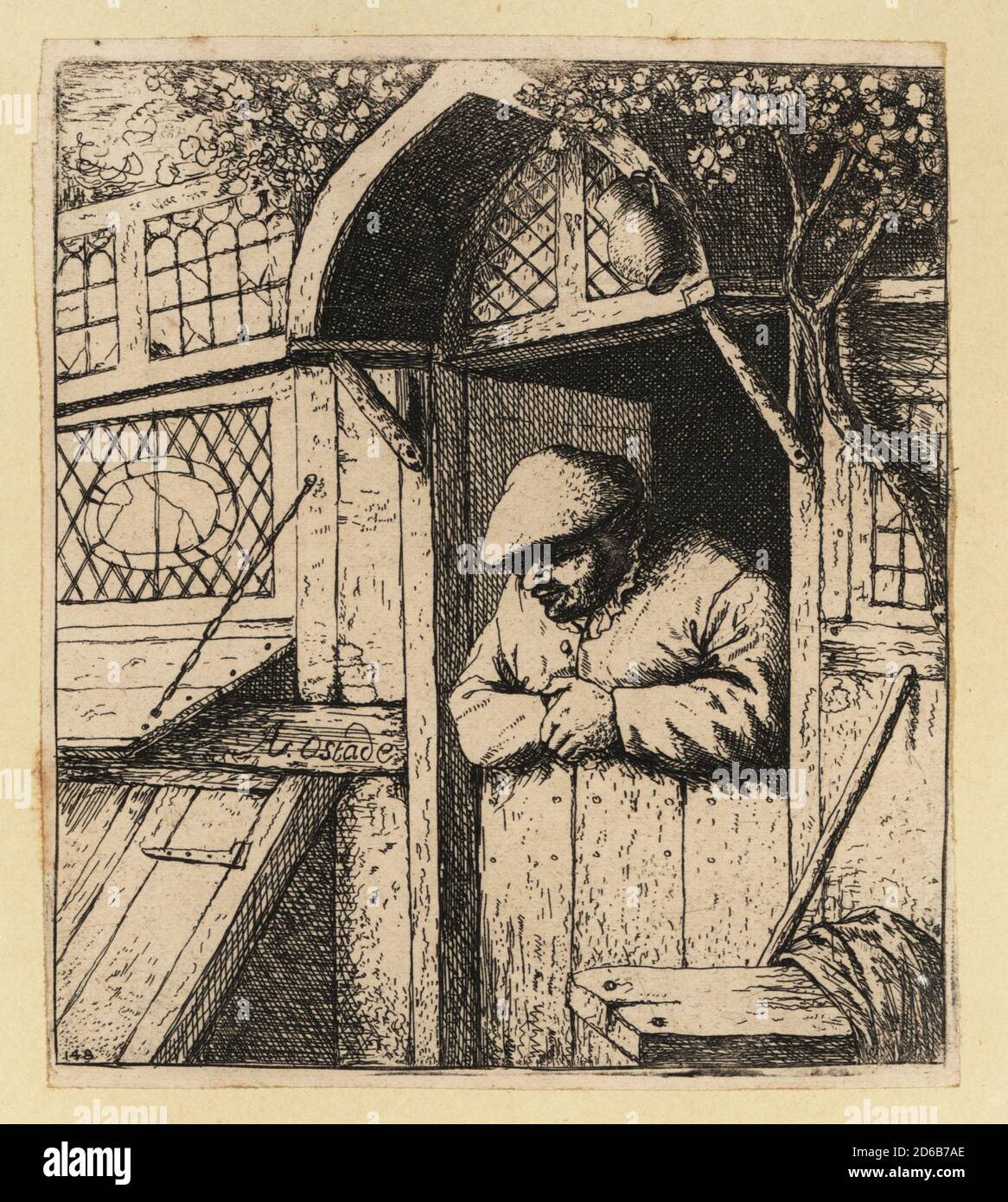 17th century Dutch peasant in cap leaning on his door gate. The house ...
