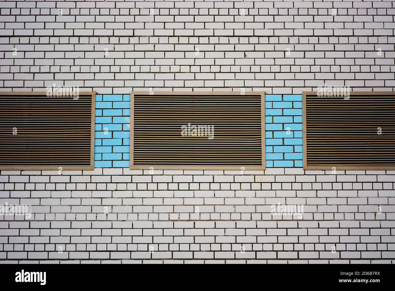 White brick wall with windows. Blue brick. Pattern Stock Photo - Alamy