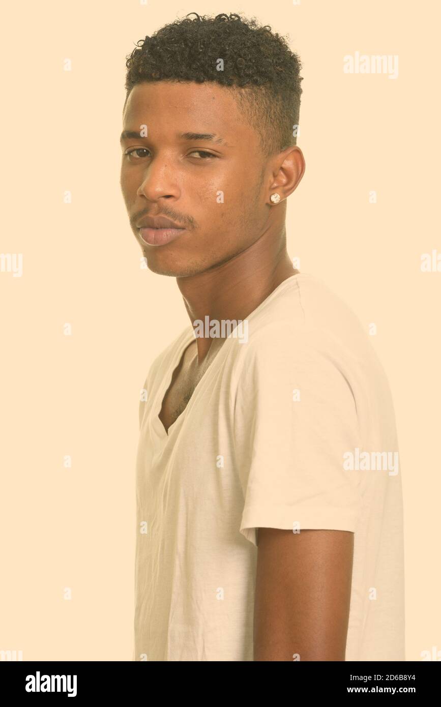 Portrait of young handsome African man with afro hair Stock Photo - Alamy