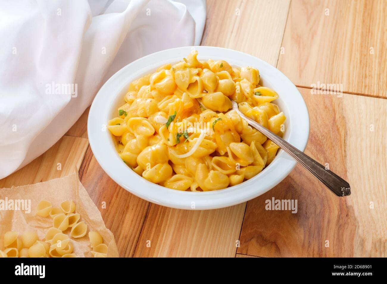 Delicious macaroni and cheddar cheese shell noodles in a bowl Stock ...