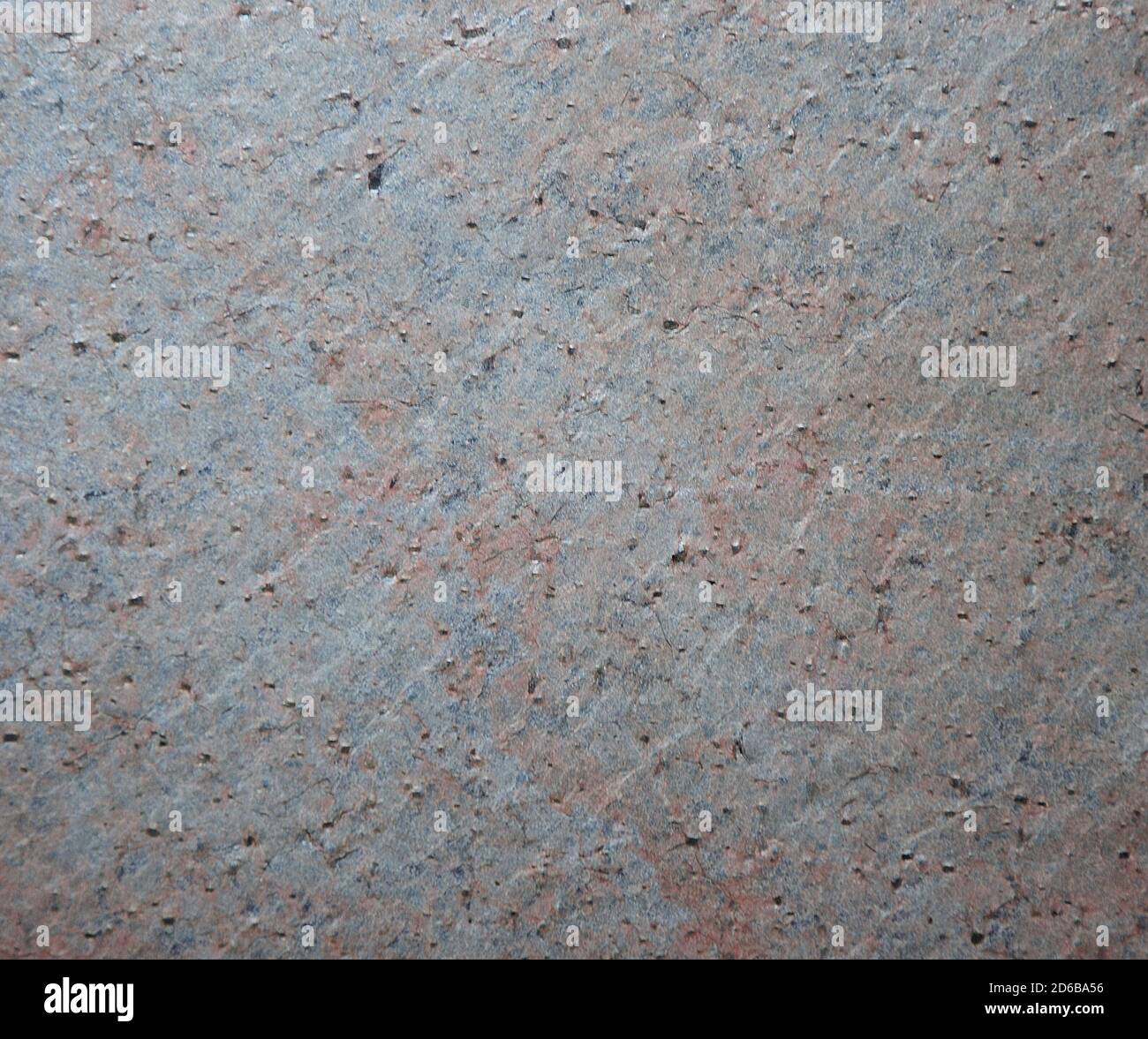 Gray natural stone with traces of erosion and chipped inclusions ...