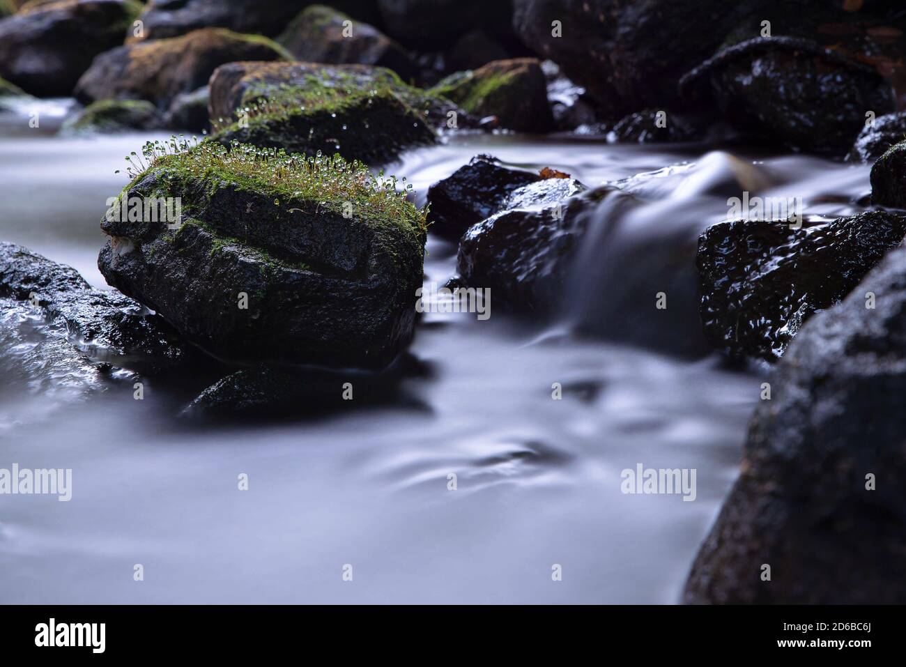 Water flowing into a rock hi-res stock photography and images - Alamy