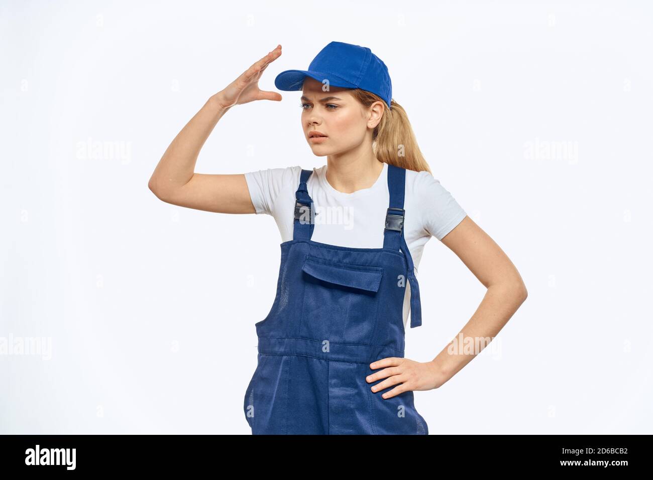 Working woman in blue cap uniform lifestyle emotions service light ...