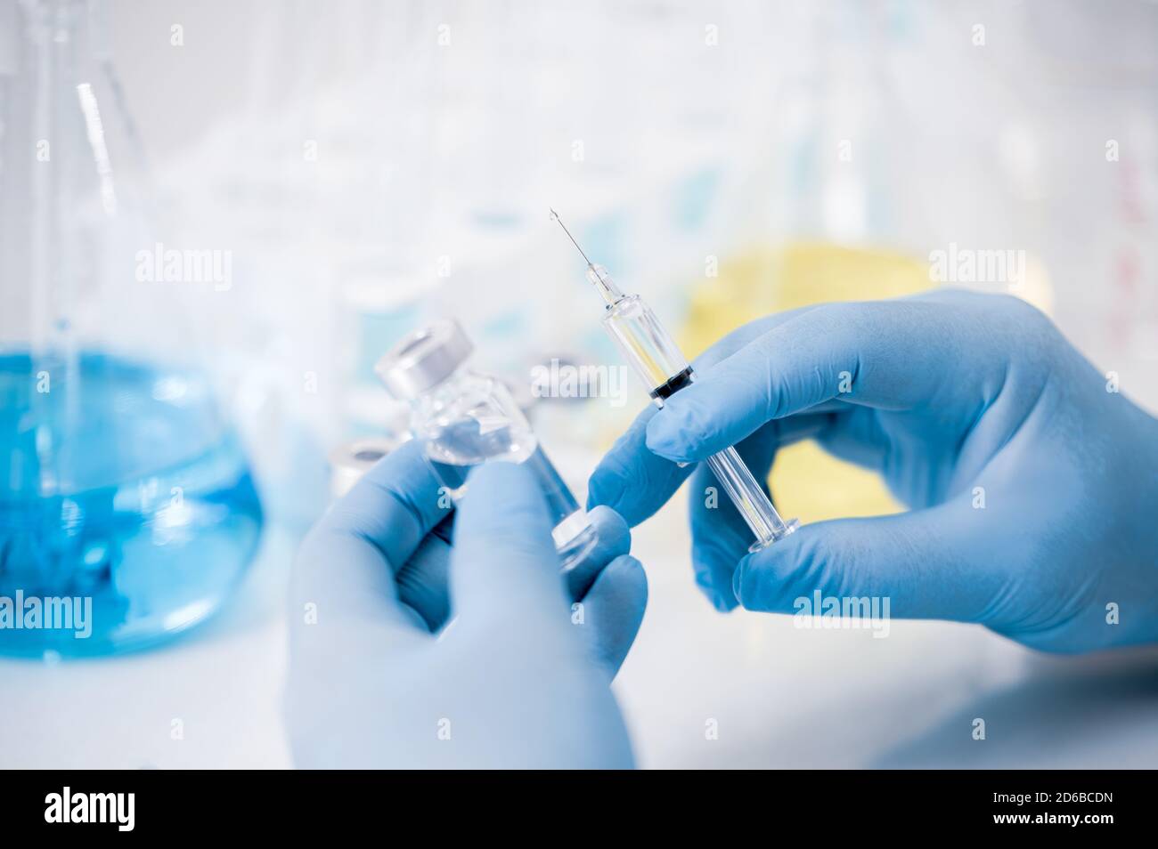 Hand of a scientist working in the laboratory. Vaccine development ...