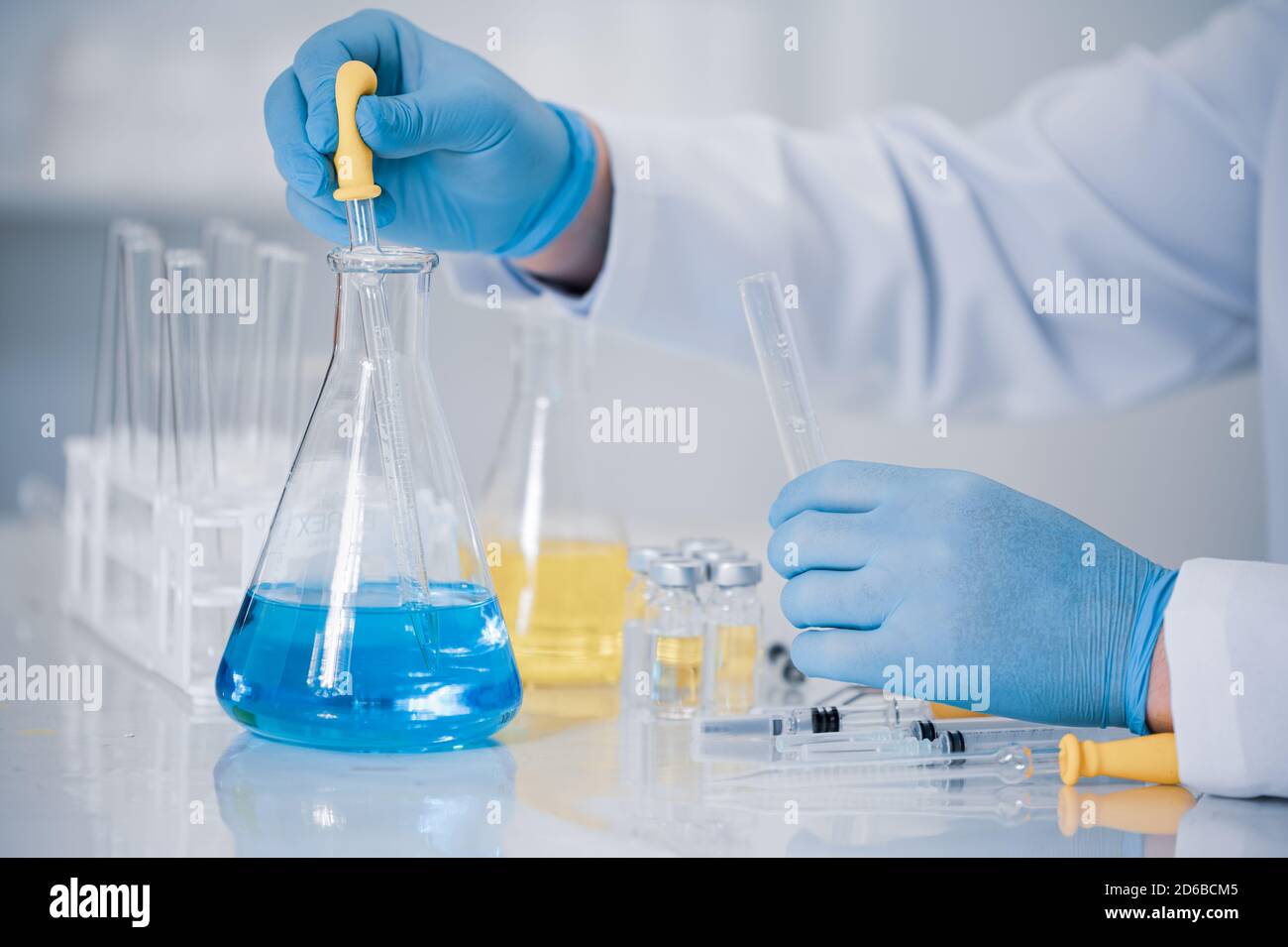 Hand of a scientist working in the laboratory. Vaccine development ...