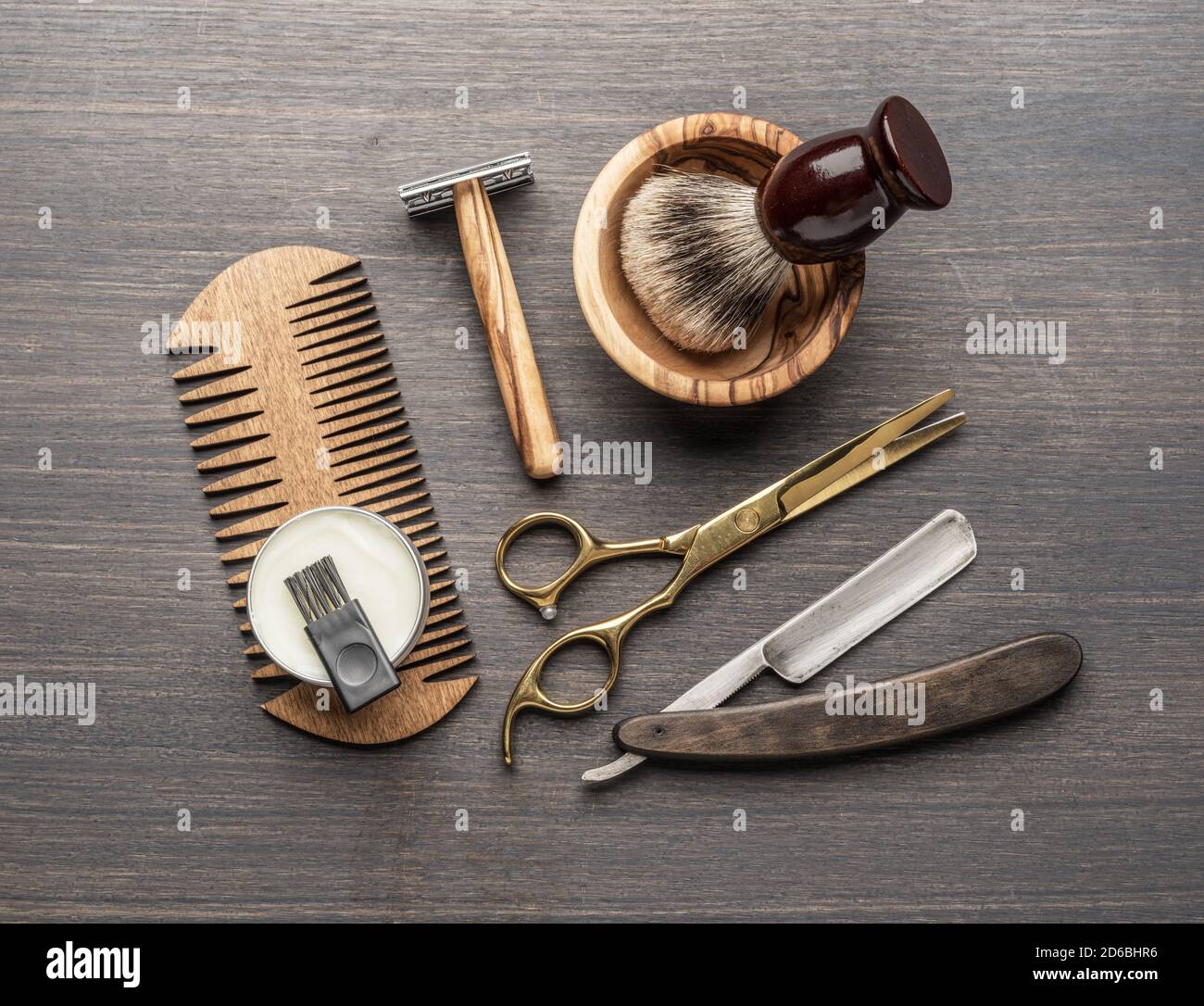 Classic grooming and hairdressing tools on wooden background. Top view ...