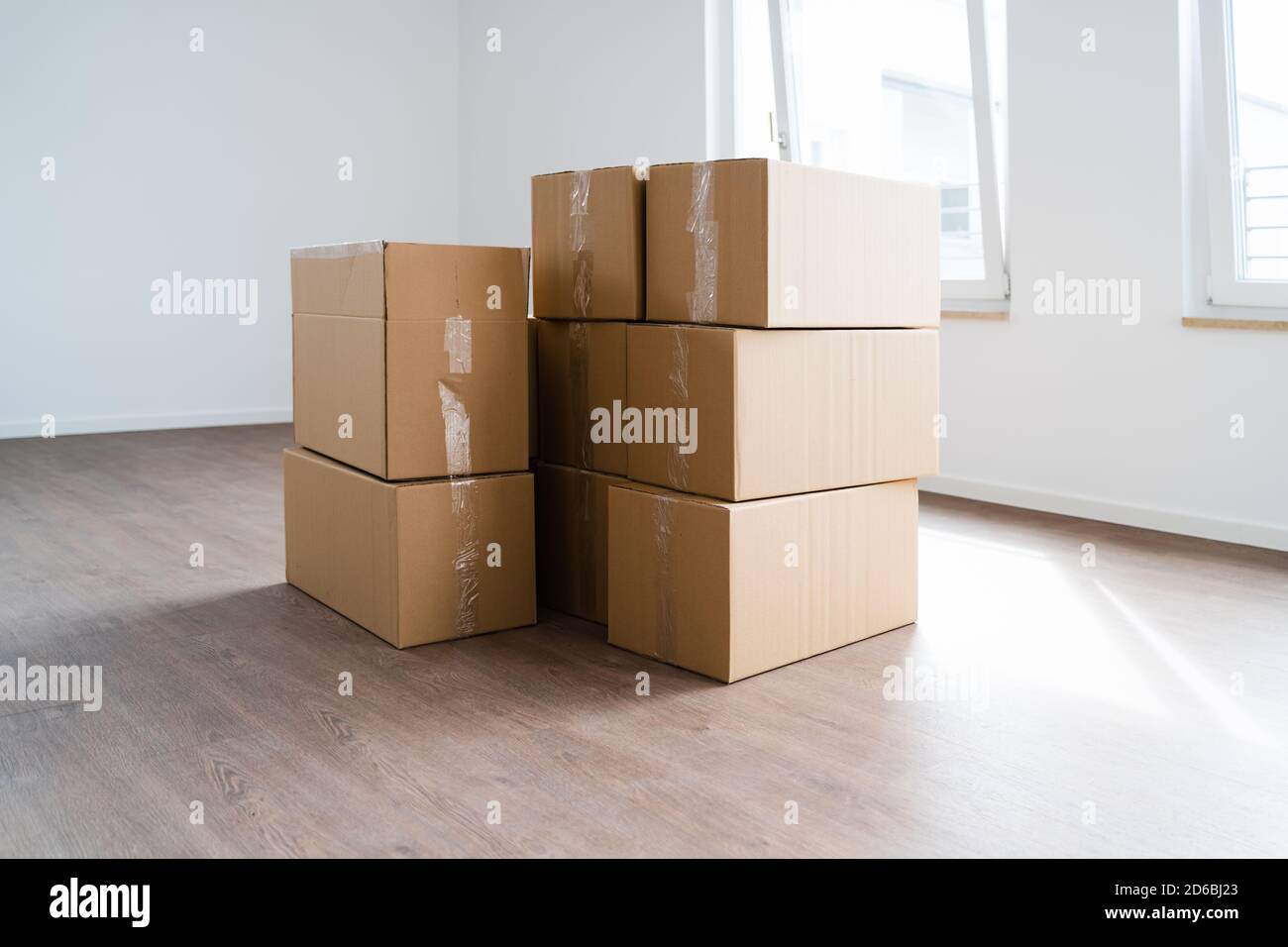 Empty Room With Moving Boxes Or Cartons Stock Photo - Alamy