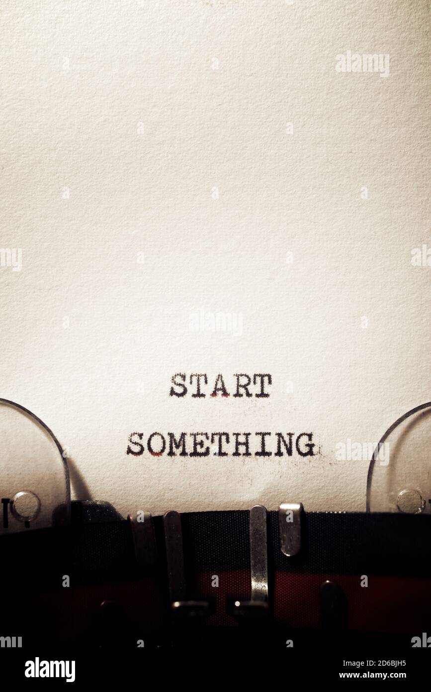 Start something phrase written with a typewriter Stock Photo - Alamy