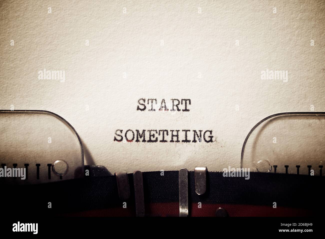 Start something phrase written with a typewriter Stock Photo - Alamy