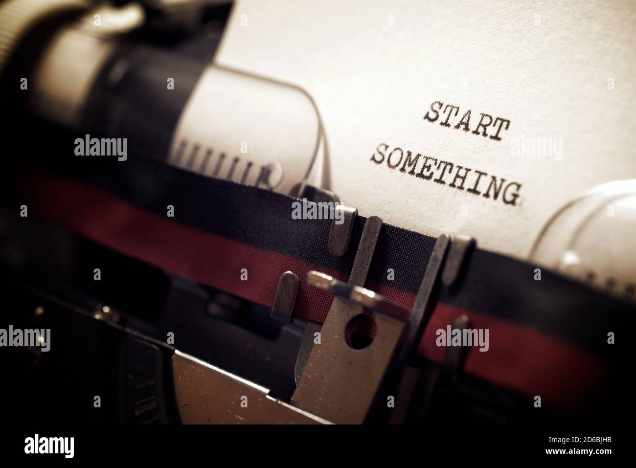 Start something phrase written with a typewriter Stock Photo - Alamy