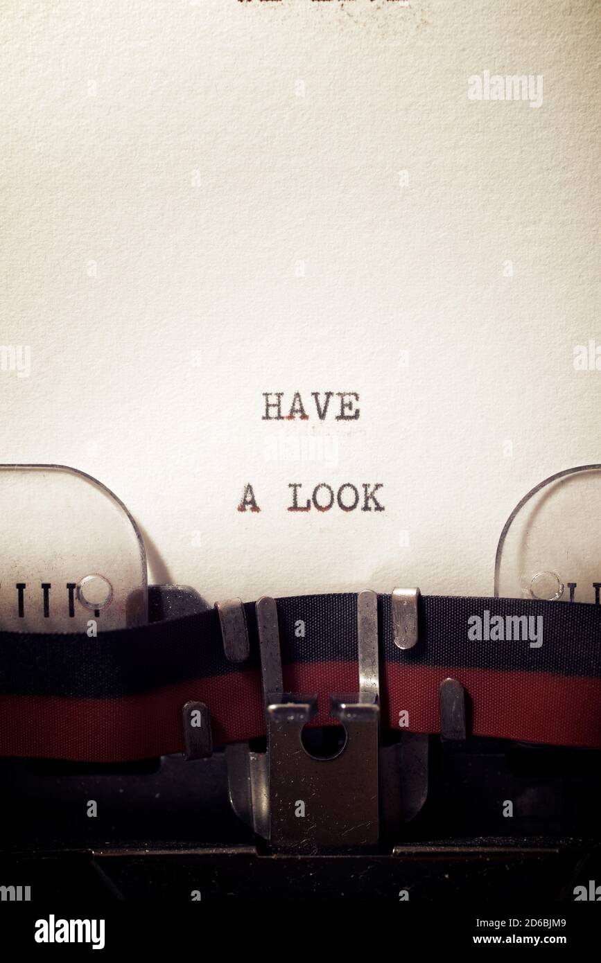 Have a look phrase written with a typewriter Stock Photo - Alamy