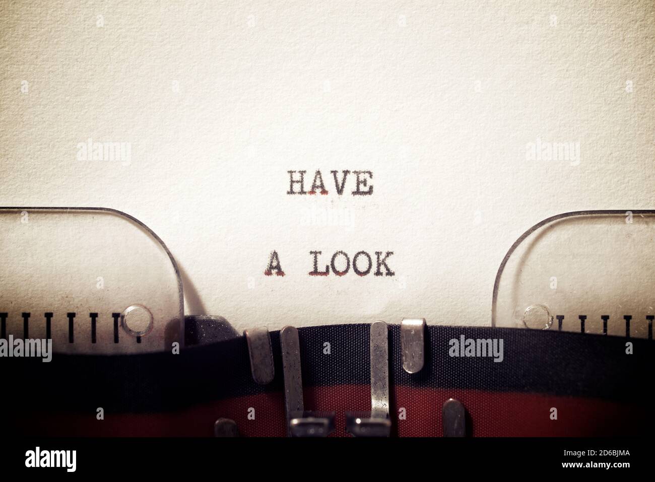 Have a look phrase written with a typewriter Stock Photo - Alamy