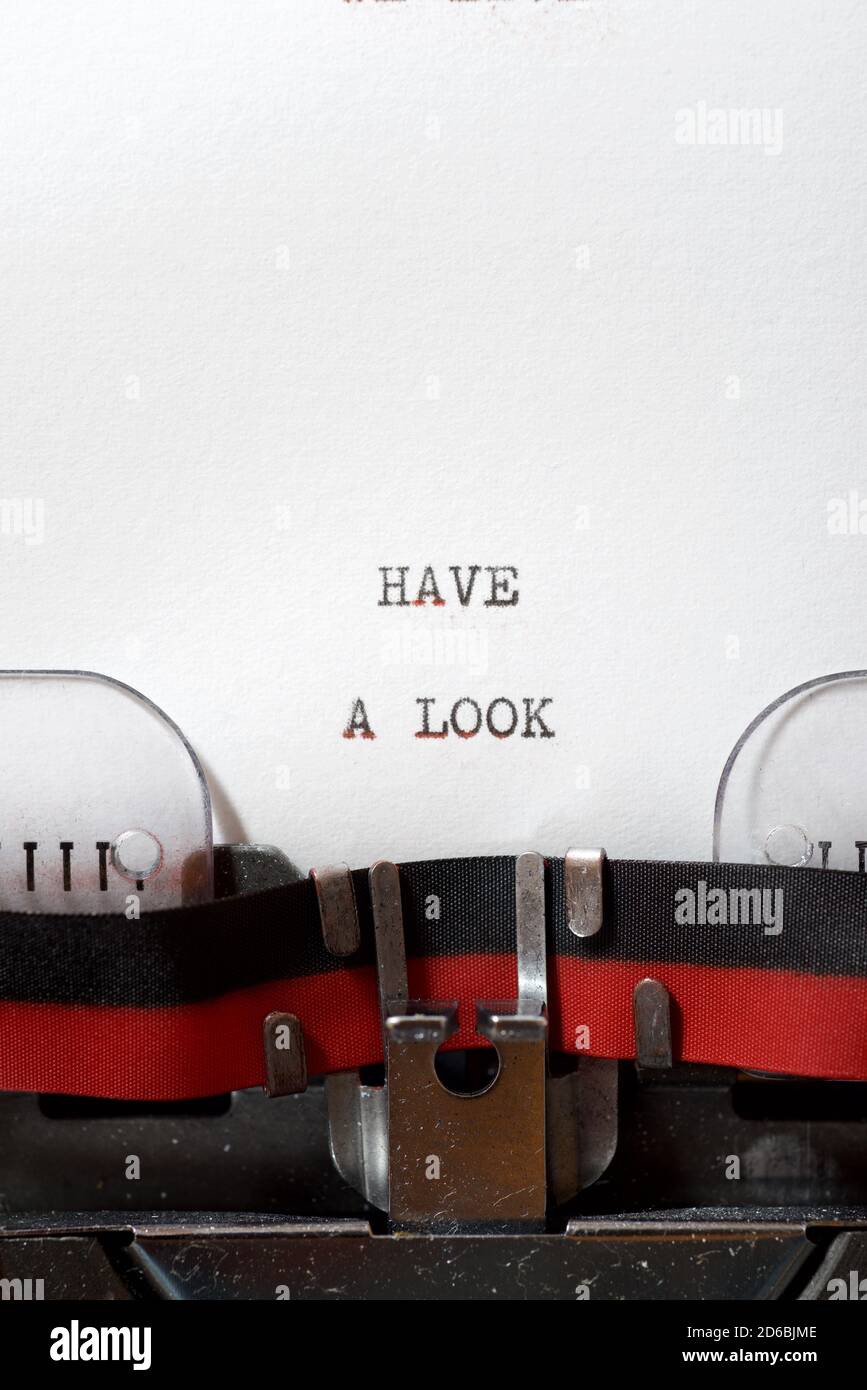 Have a look phrase written with a typewriter Stock Photo - Alamy