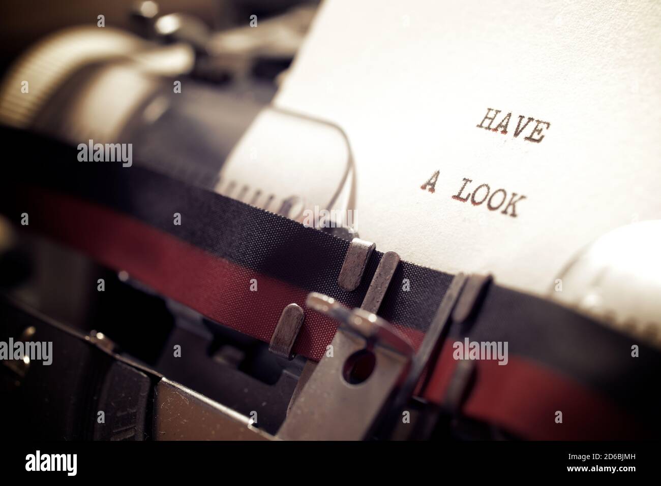 Have a look phrase written with a typewriter Stock Photo - Alamy