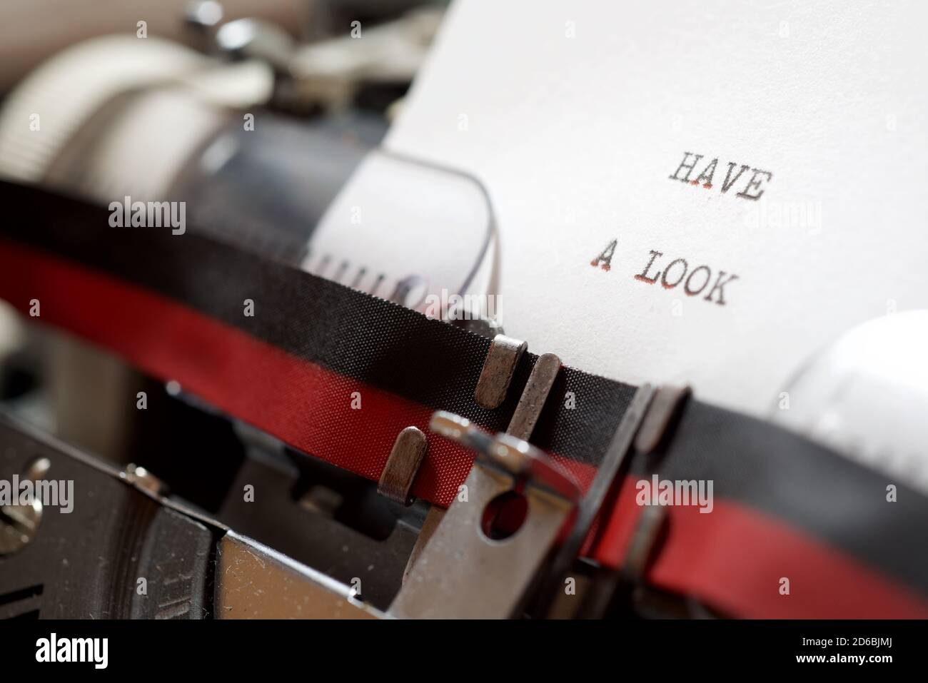 Have a look phrase written with a typewriter Stock Photo - Alamy