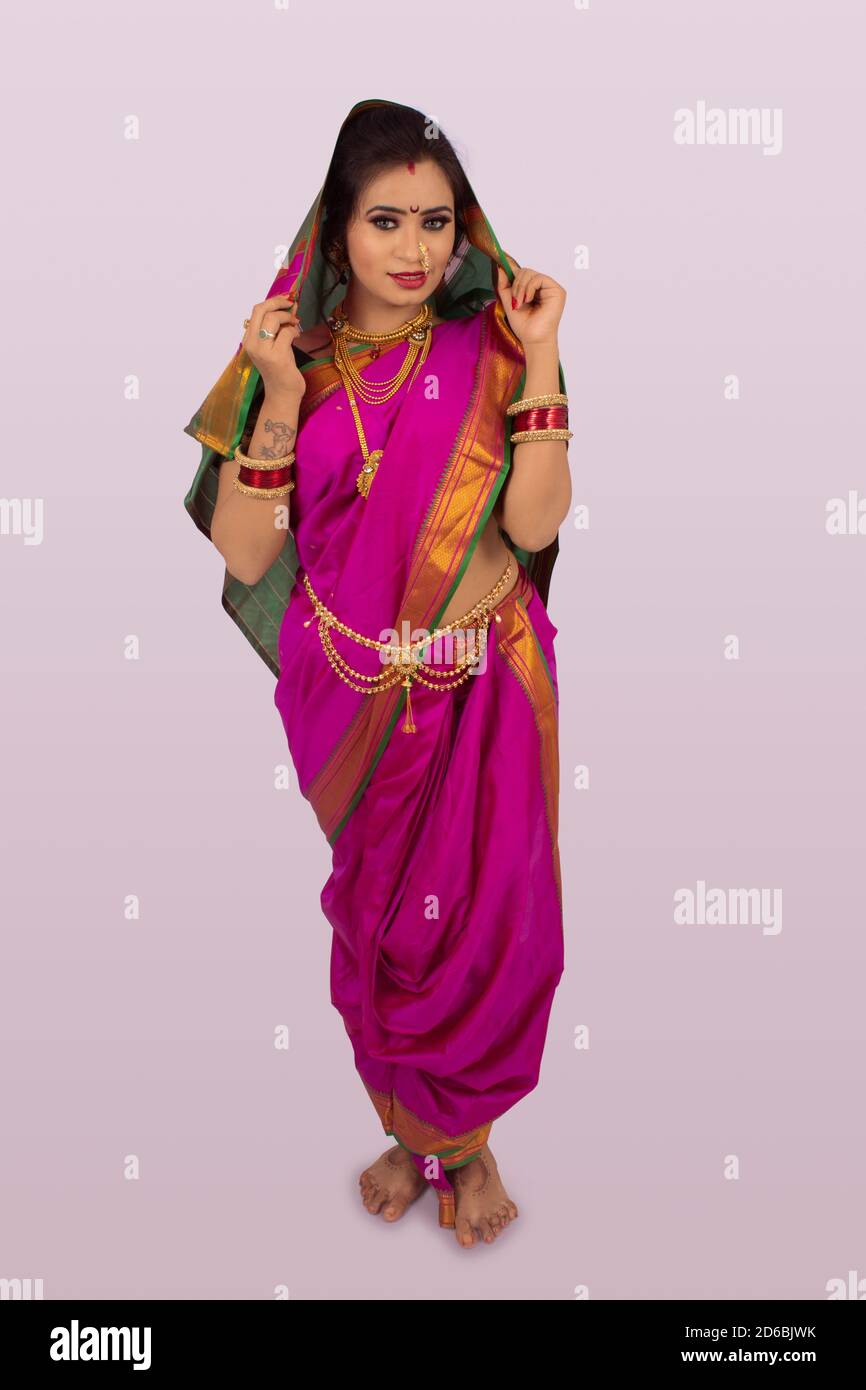 Indian model dressed in Maharashtrian bridal wear with purple Sari ...